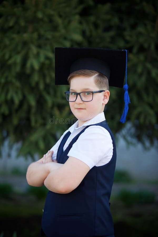 The Boy is a Graduate of Elementary School in a Graduate Hat Stock ...