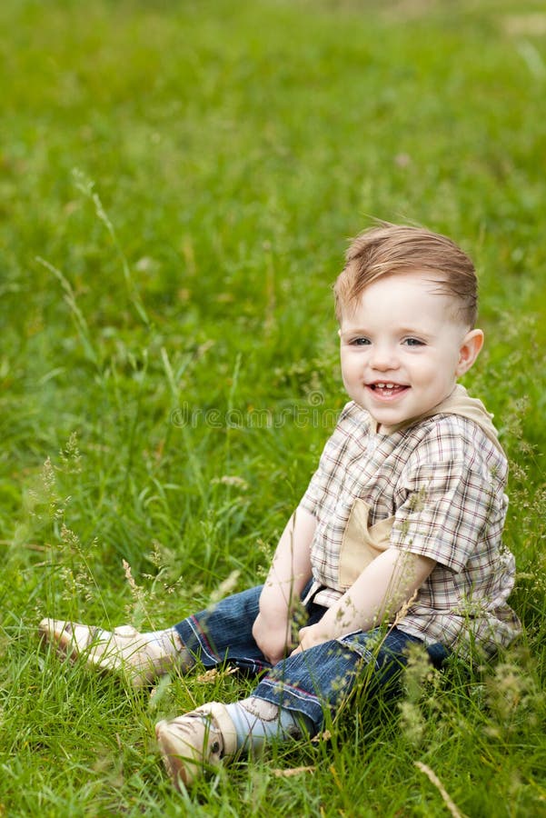Boy on grass stock image. Image of caucasian, positive - 17784049