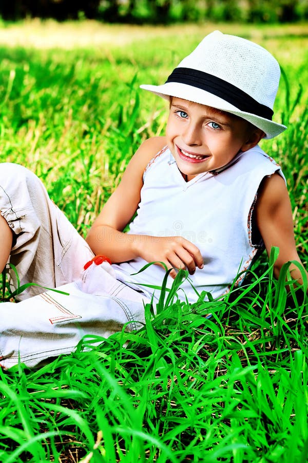 Boy on grass stock image. Image of holiday, rest, green - 23779573