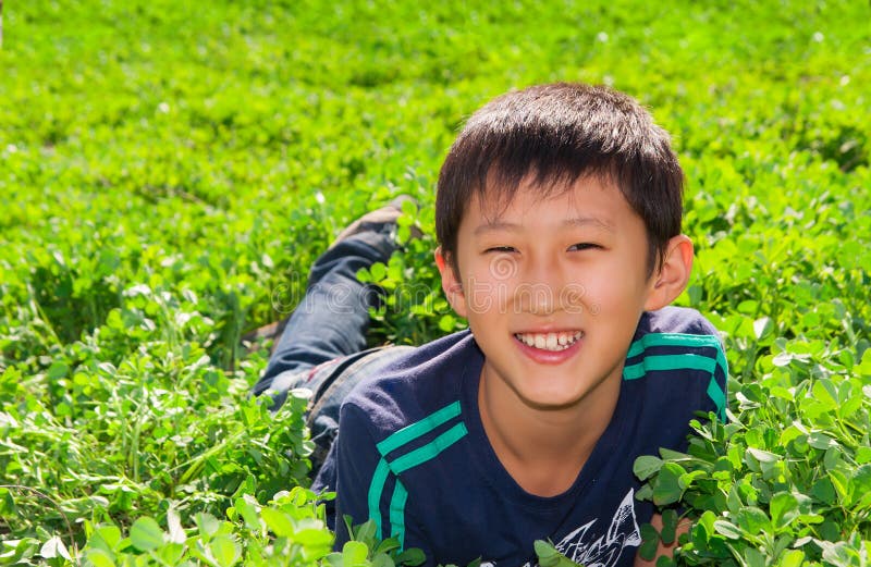 Boy on the grass stock image. Image of front, green, life - 30317233