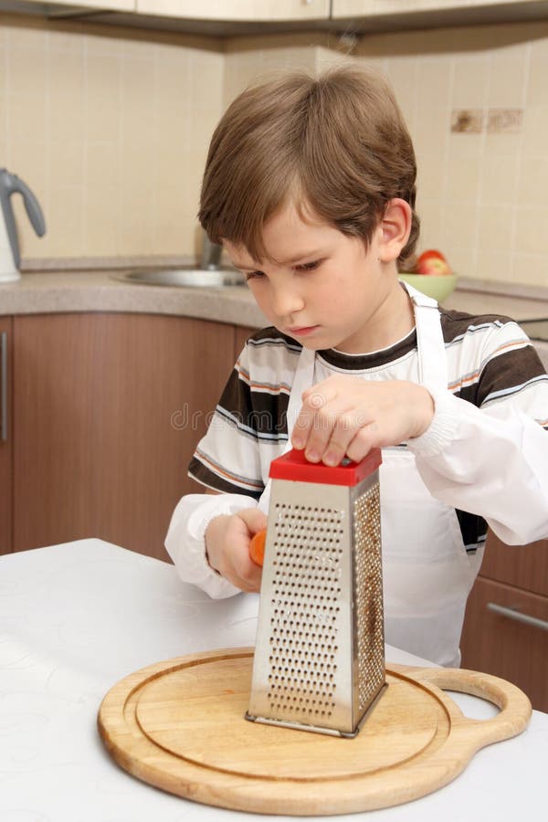 A boy with grater stock image. Image of table, board - 29402983