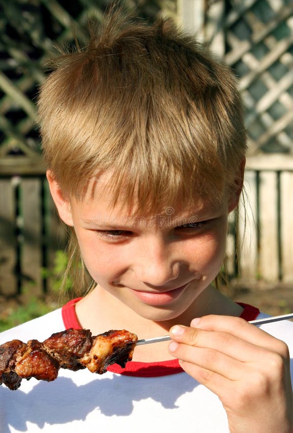 Boy with grilled meat stock image. Image of outdoor, meat - 15716605