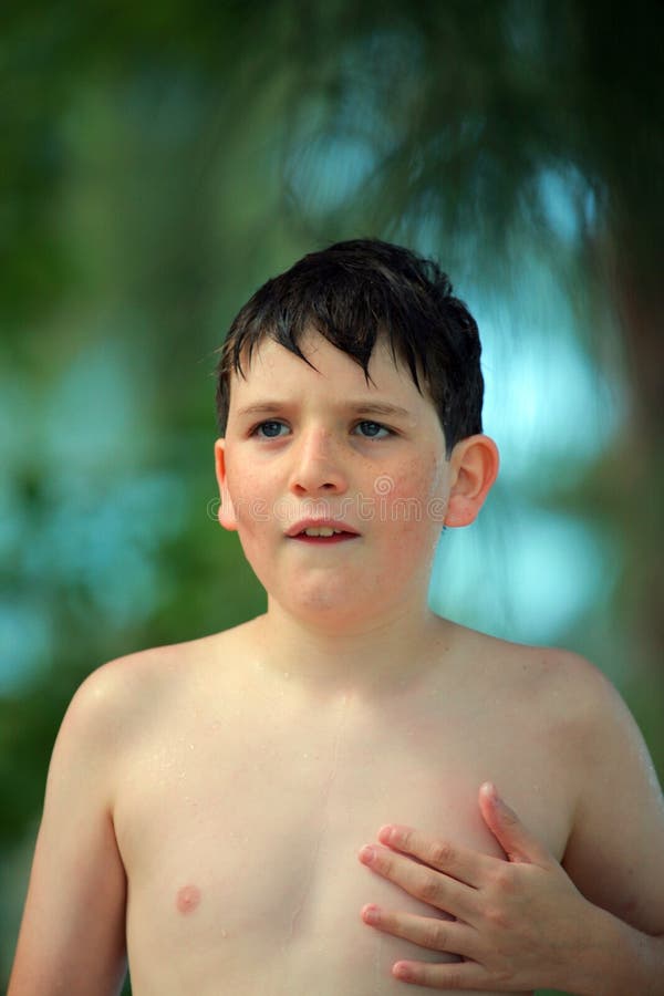 Boy with hand on heart stock image. Image of game, heart - 8931275