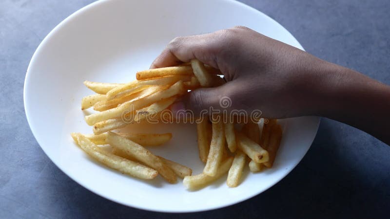 Boy Hand Pick French Fries from a Plate on Table Stock Video - Video of ...