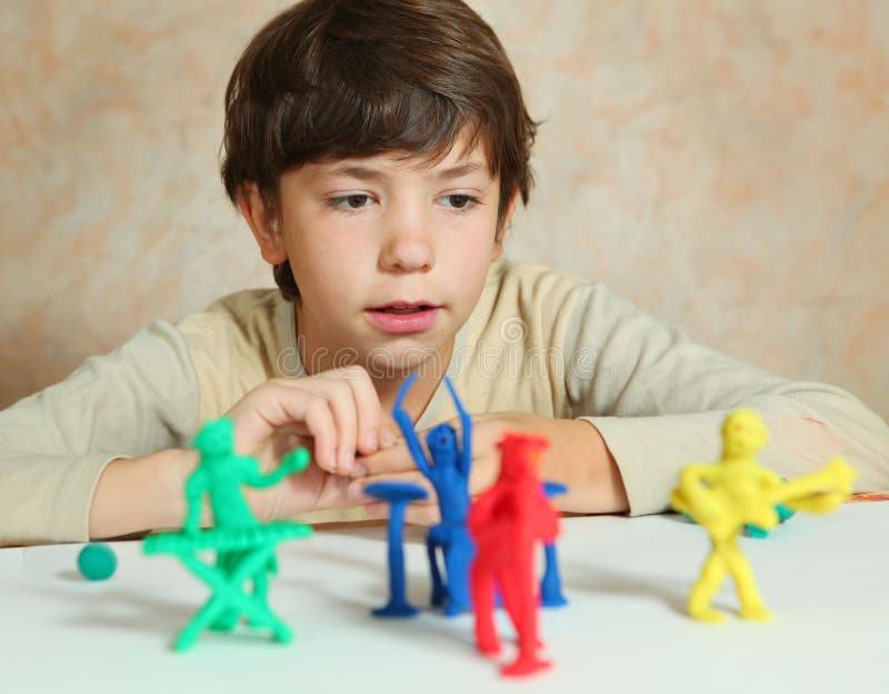 Boy Hands Making Rock Group Musician from Modeling Clay Stock Photo ...