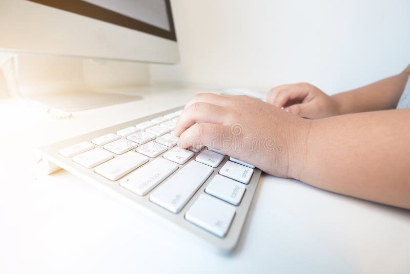 Boy Hands are Typing on Computer Keyboard. Side View Stock Image ...