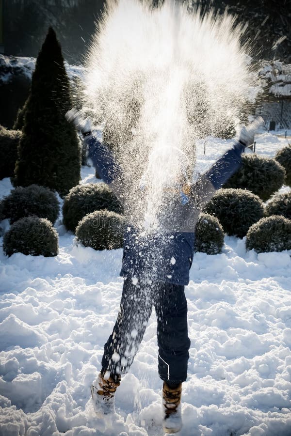 Boy throwing snow up stock image. Image of blue, happiness - 233161019