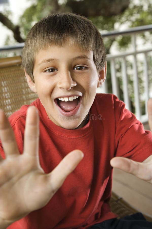 Boy with happy expression. stock image. Image of reaching - 2038177
