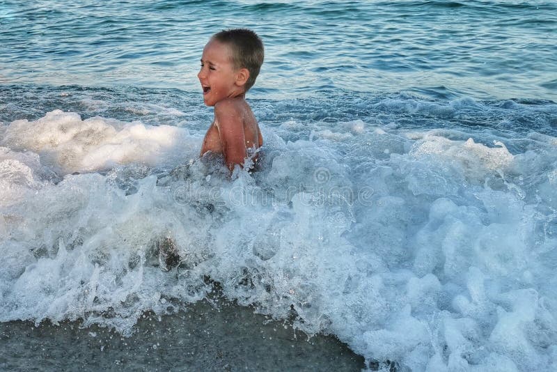 Boy happy in the sea stock photo. Image of shore, surfing - 183567588