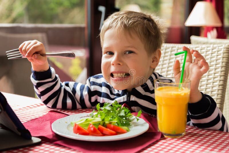 The boy has breakfast stock photo. Image of cheerful - 55668364