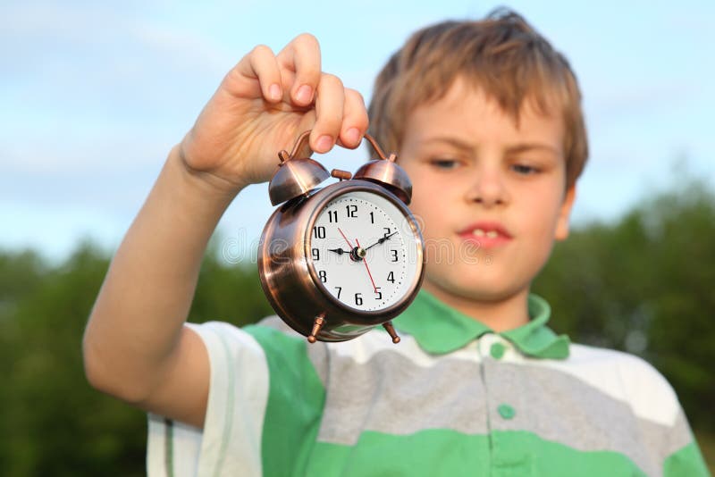 Mom Showing Kid Clock that it is Time To Go To Bed. he Doesn T Like ...
