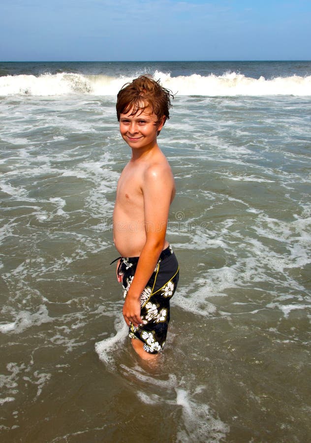 Boy Has Fun in the Stormy Beach Stock Image - Image of beach, skin ...