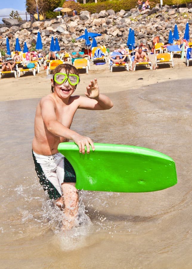 Boy Has Fun with the Surfboard Stock Image - Image of smile, outdoor ...