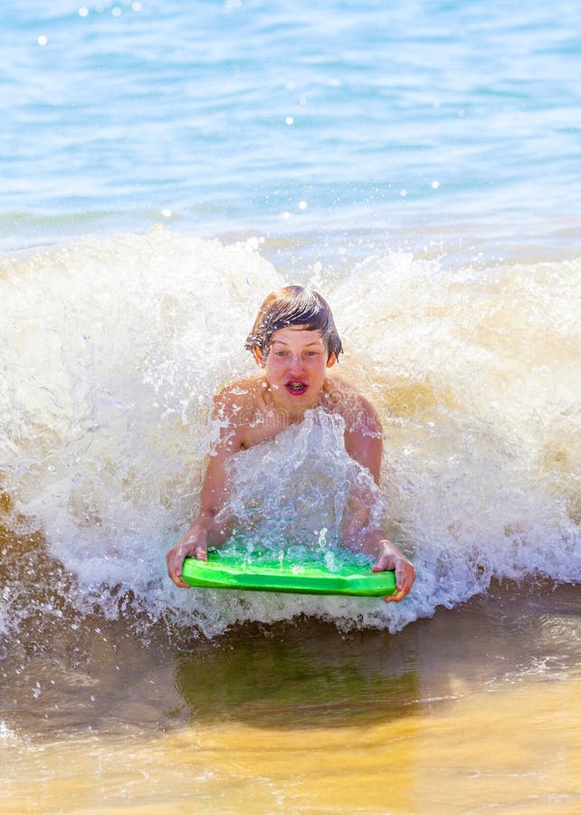 Boy Has Fun in the Waves of the Ocean Stock Image - Image of sport ...