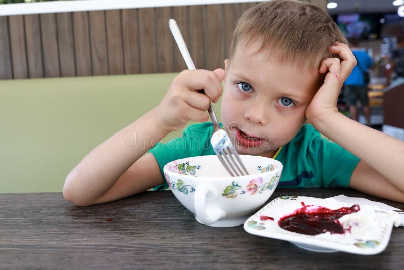 Boy has lunch stock image. Image of lifestyle, berry - 161705817