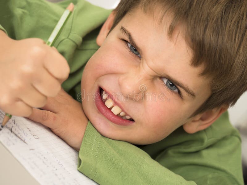 Boy hates doing homework stock image. Image of hard, hate - 28175421