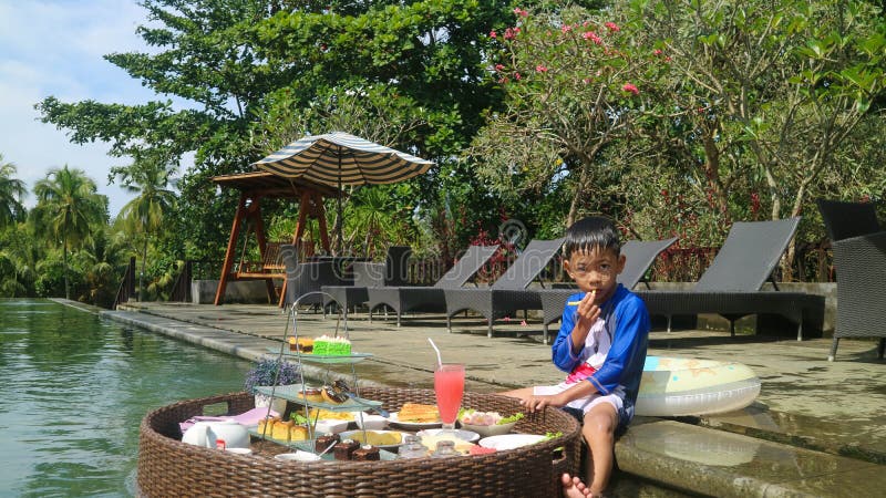 Breakfast on Floating Table in the Pool. Stock Photo - Image of food ...