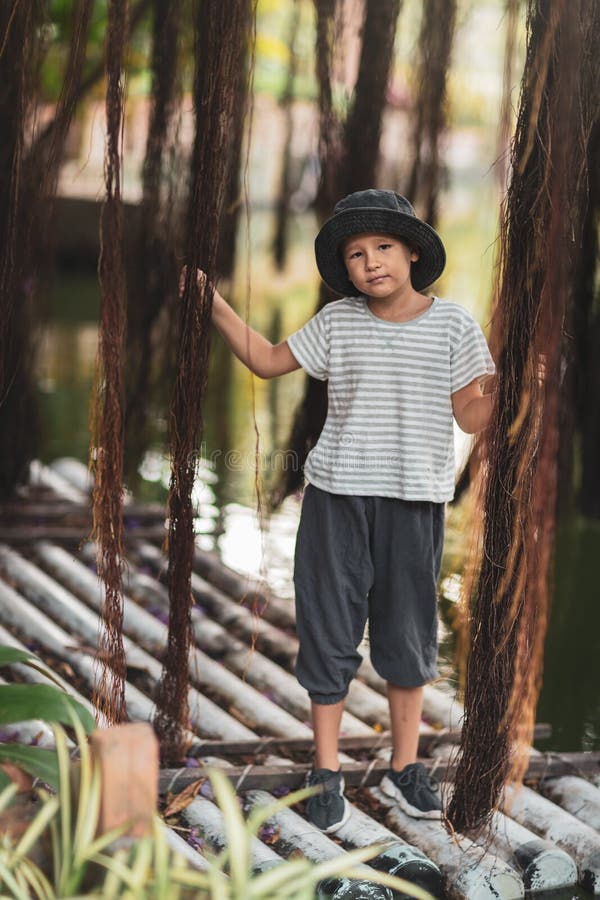 Boy having fun on the lake stock photo. Image of banyan - 216565208