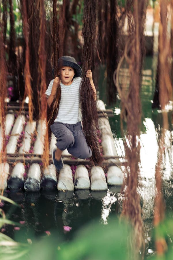 Boy having fun on the lake stock image. Image of outdoor - 216565211