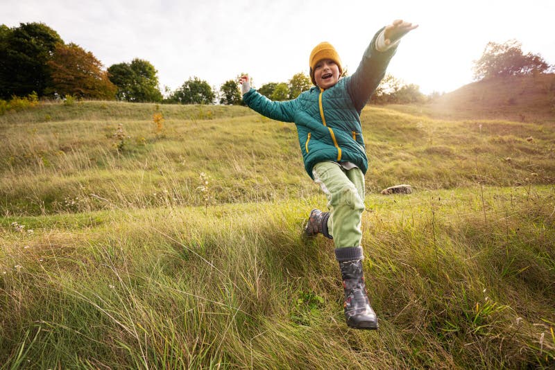 Boy Having Fun Run and Jump Outdoor Near Forest Stock Photo - Image of ...