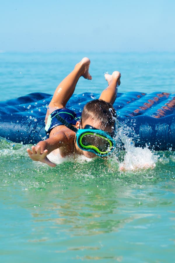 Boy having fun in sea stock image. Image of blue, adventure - 76664393