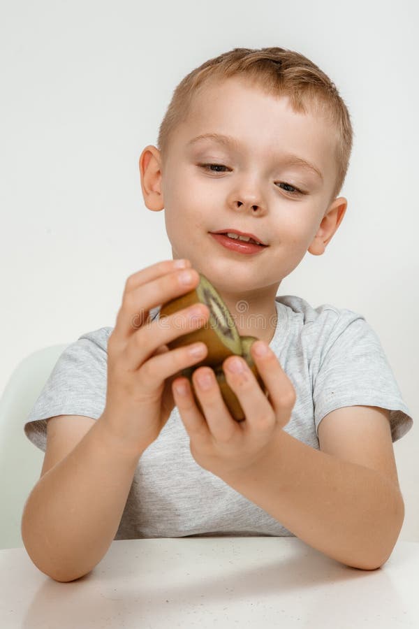 A Boy Having Fun on Studio Grey Background. Stock Photo - Image of ...