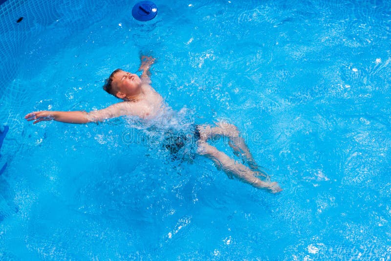 Boy in Having Fun in the Swimming Pool Stock Photo - Image of family ...