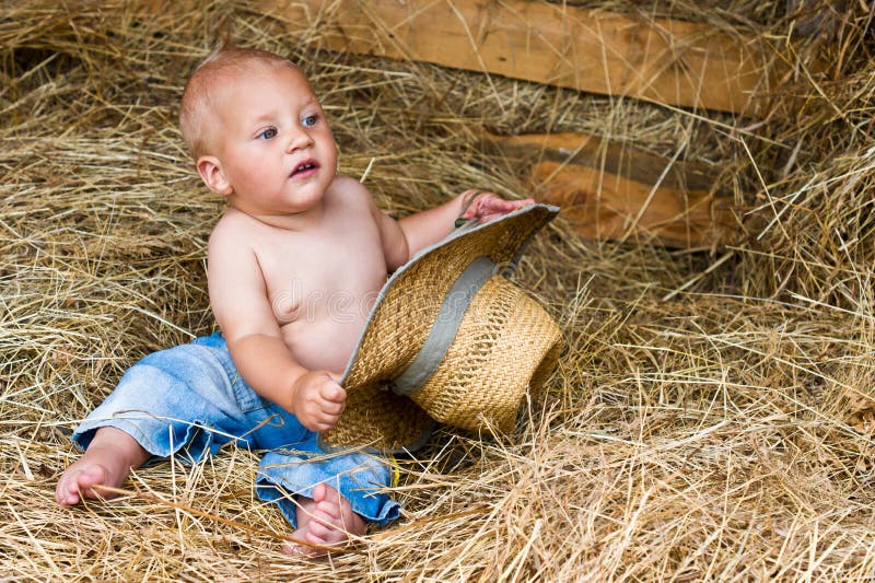 Boy in a hay stock photo. Image of family, childhood - 29578170