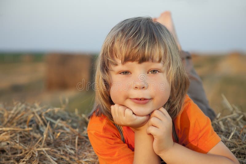 Boy in a Haystack in the Field Stock Photo - Image of lifestyles ...