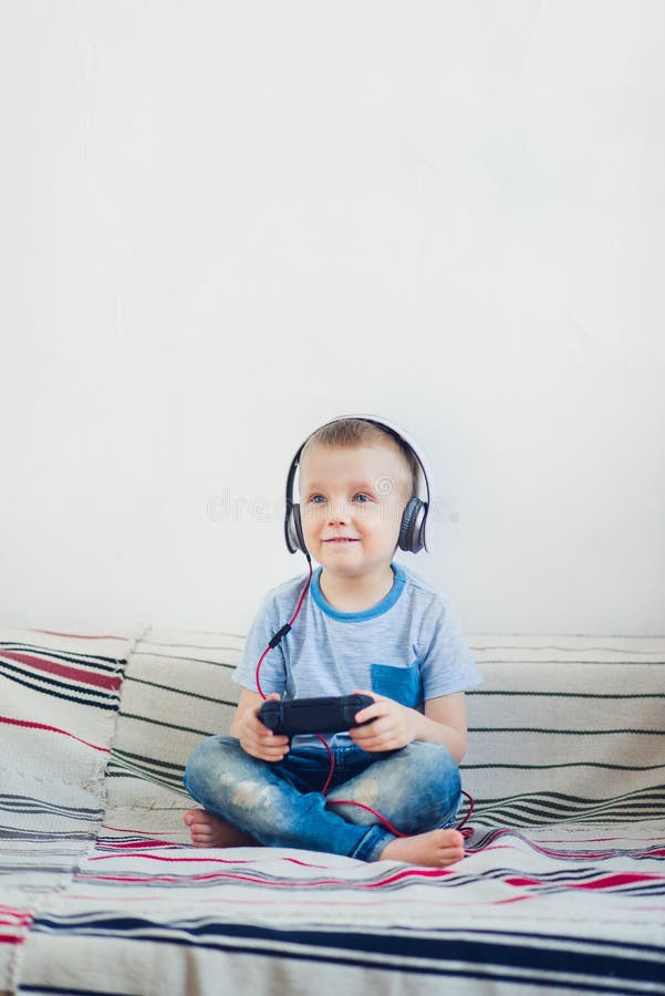 Boy Playing With Playstation Stock Image - Image of background, floor ...