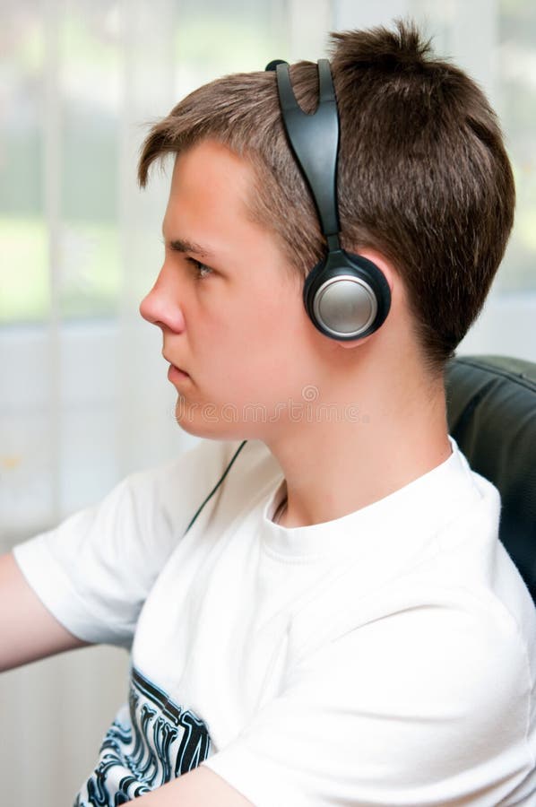 Boy listening to music stock image. Image of ears, youthful - 24380413