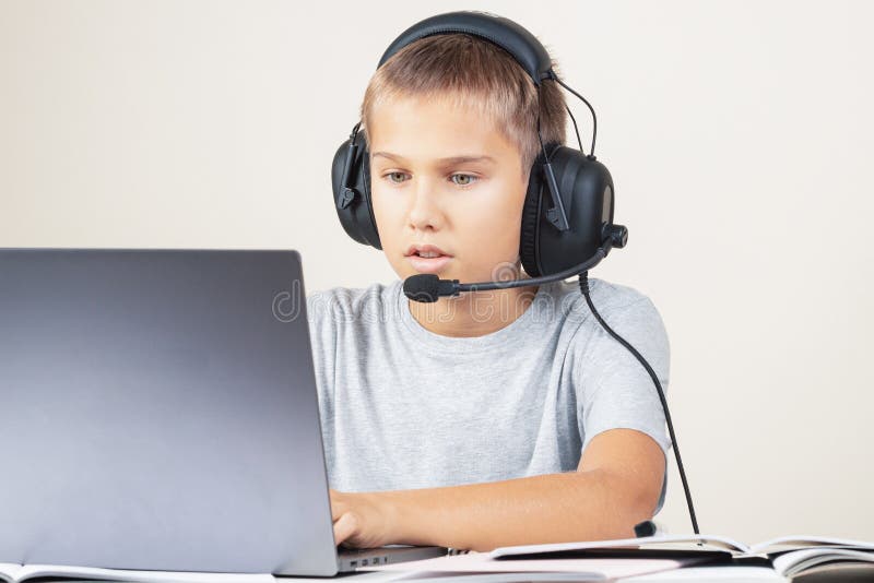Boy in a Headphones with Notebook Computer. Online Learning, Remote ...