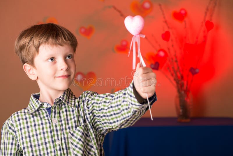 Boy with a Heart in His Hands Stock Photo - Image of rose, smiling ...