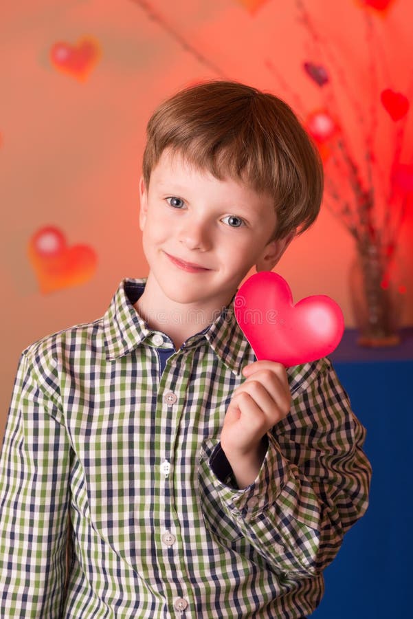 Boy with a Heart in His Hands Stock Photo - Image of shape, excited ...