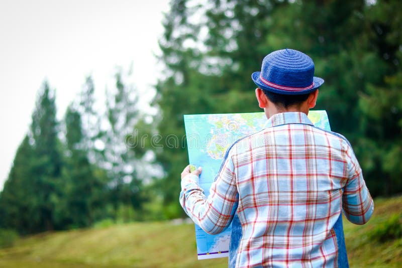 The Boy Held a Map To Study the Path. Stock Photo - Image of outdoor ...