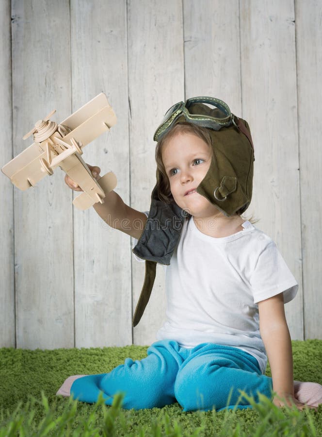 Boy in Helmet Pilot Playing with a Airplane Stock Image - Image of ...