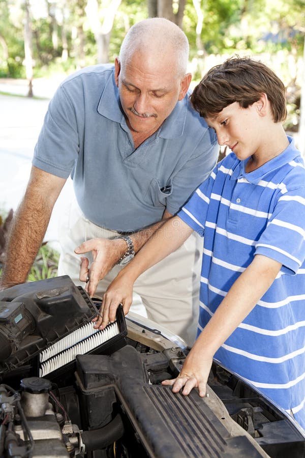 Boy Helps Dad stock image. Image of person, people, auto - 18367931