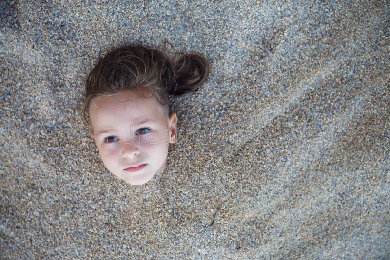 Boy Hidden in the Sand on the Beach Stock Image - Image of people ...