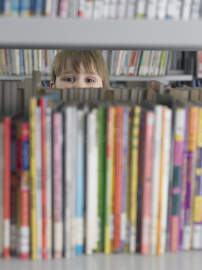 Boy Hiding Behind the Books Stock Image - Image of hide, ethnicity ...