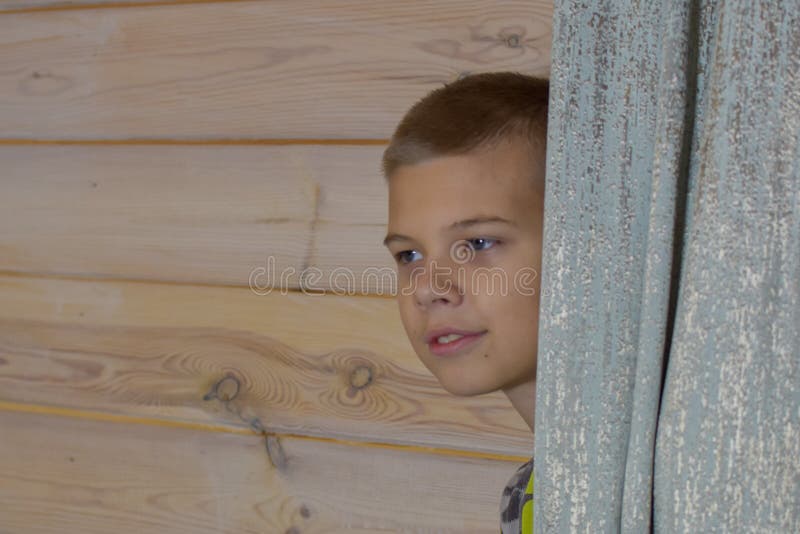 Boy is Hiding Behind Curtain. Child Overhears Conversation Stock Image ...
