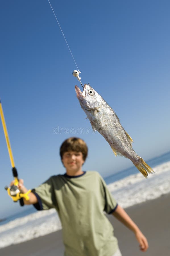 Boy with His Catch on Beach Stock Photo - Image of catch, leisure: 29647696