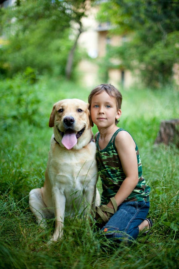 Happy Young Boy Lovingly Hugging His Pet Dog Stock Photo - Image of ...