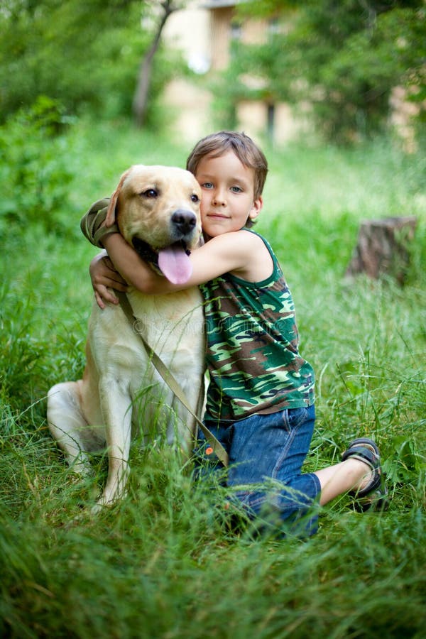 Little Boy Playing with His Dog Stock Photo - Image of play, back: 32613522