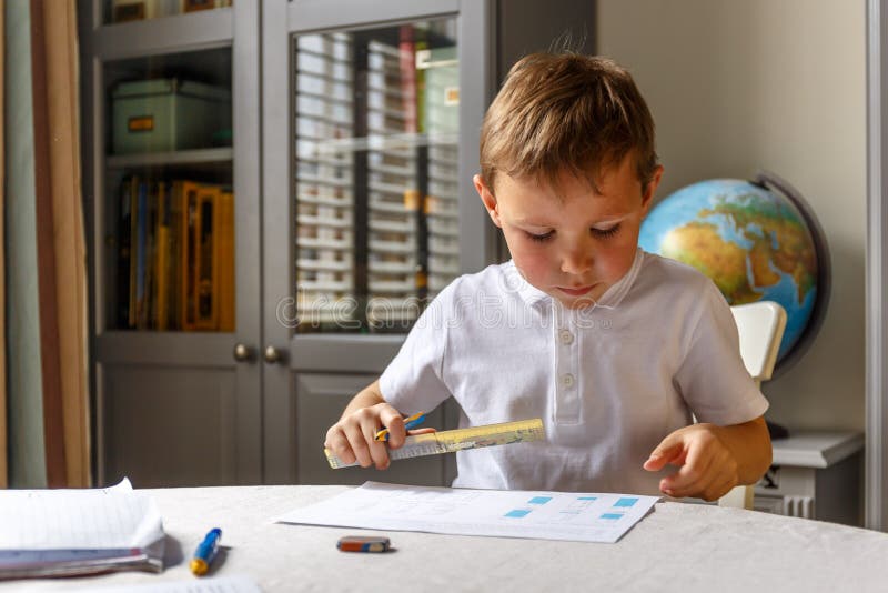 Boy at his homework stock image. Image of full, education - 69996555