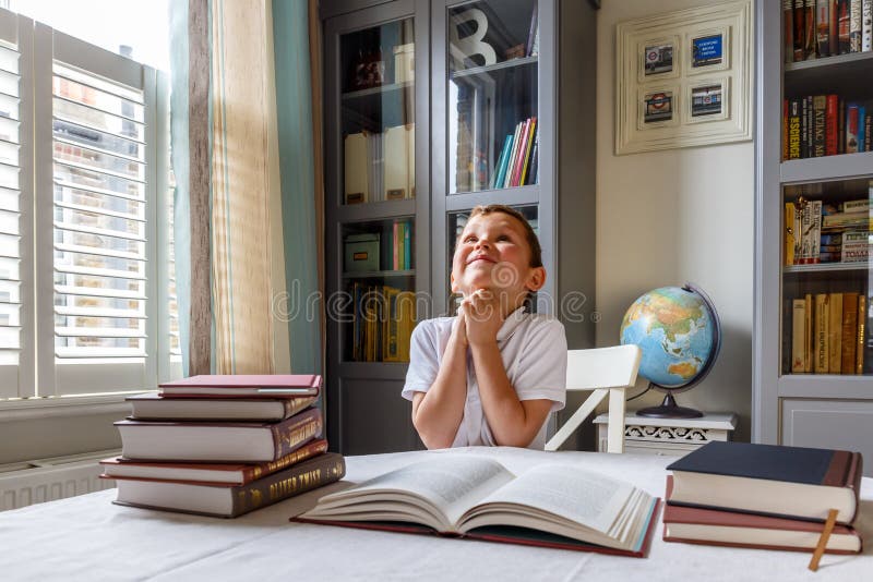 Boy at his homework stock image. Image of hope, globe - 71798199