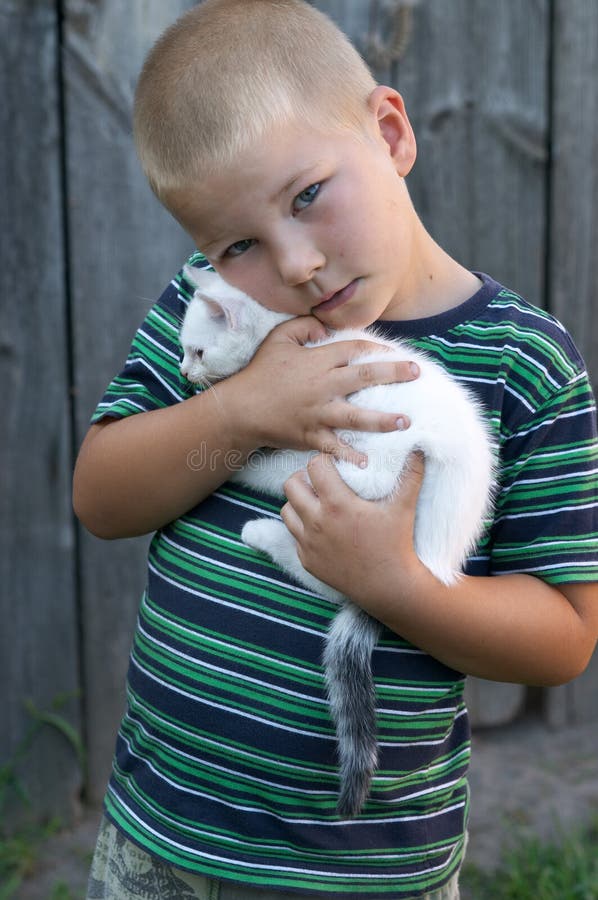 Boy and his pet stock image. Image of cudly, kitten, cute - 3088591