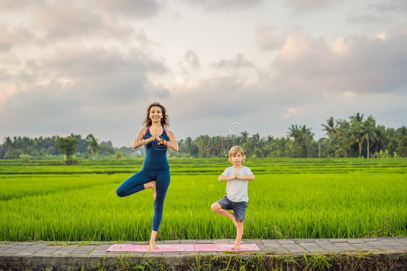 Boy and His Yoga Teacher Doing Yoga in a Rice Field Stock Image - Image ...