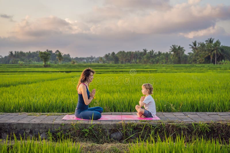 Boy and His Yoga Teacher Doing Yoga in a Rice Field Stock Image - Image ...
