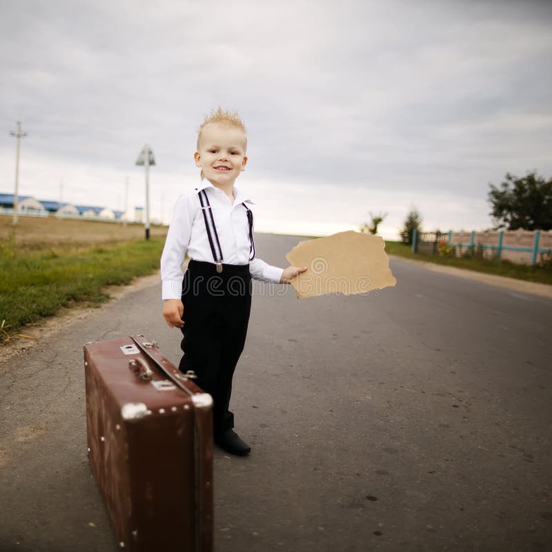 Boy hitch hiking at road stock image. Image of baby, cute - 35007105