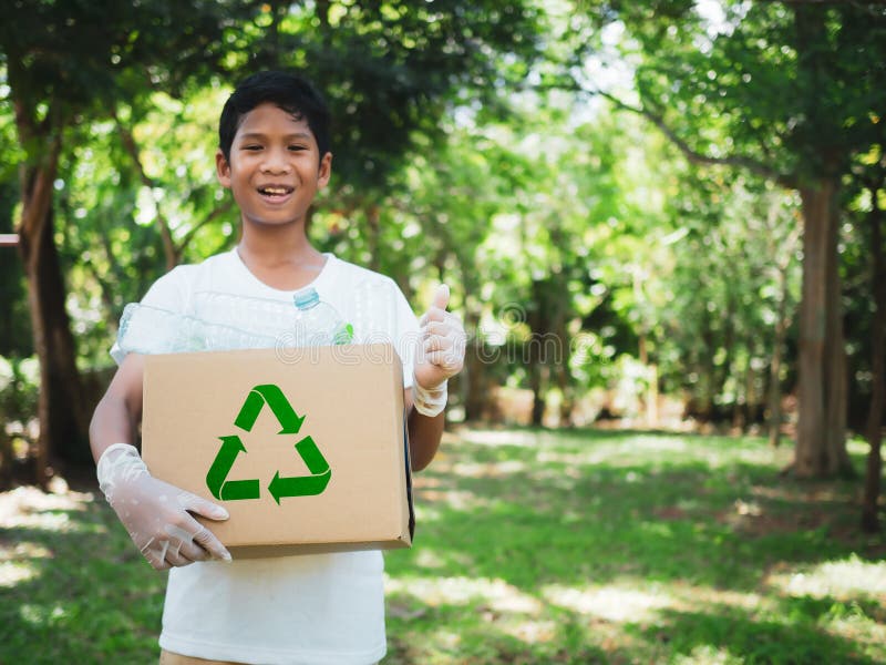 Boy Hold Cardboard Boxes for Recycling and Holding a Recycle Bin with ...